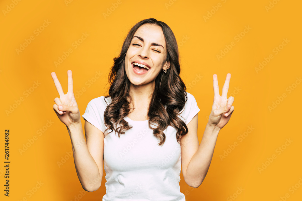 Giving a chuckle. Fabulous girl full of mirth with nice-shaped body ...