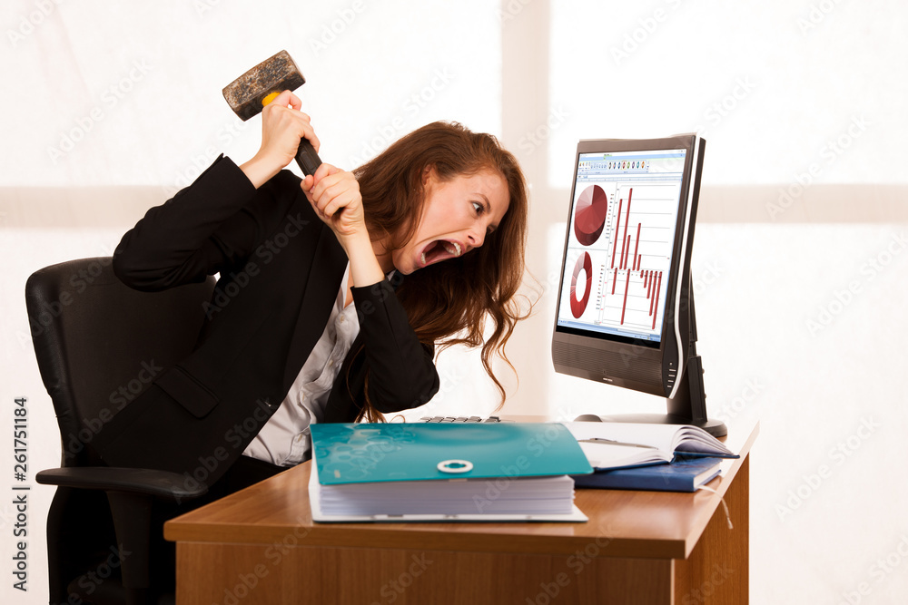 Poster Angry business woman expressing rage at her desk in the office ...