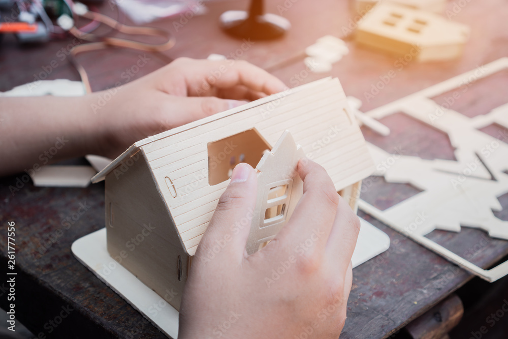 Construction building toy house or jigsaw home at outdoor near globe ...