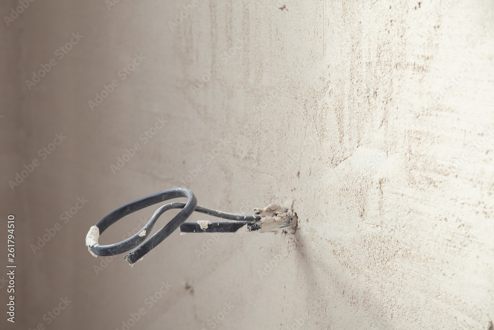 Cable laying the ceiling. Electrical wires on wall. Wiring replacement ...