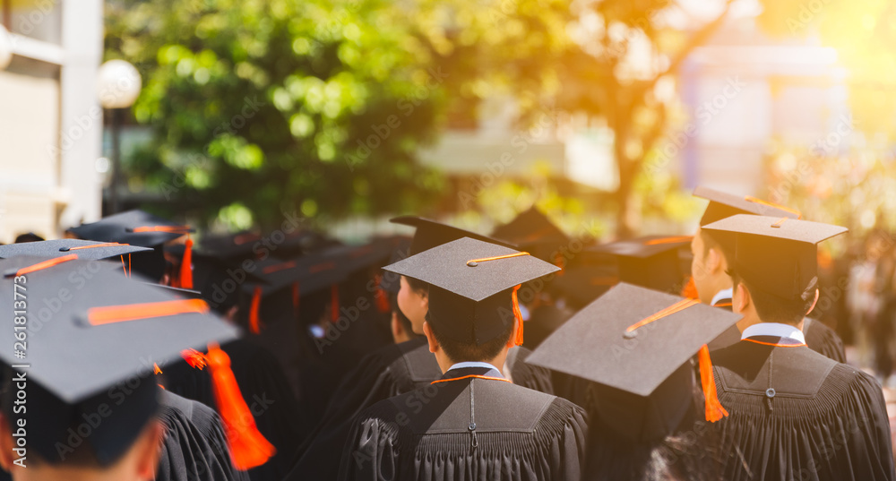 Shot of graduation hats during commencement success graduates of the ...