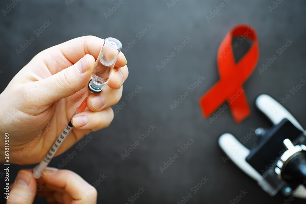 Symbol of human immunodeficiency virus disease. Red ribbon. A helping ...