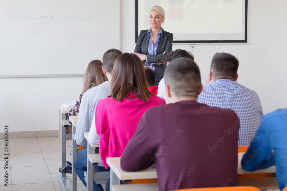 Female attractive professor explain lesson to students and interact ...