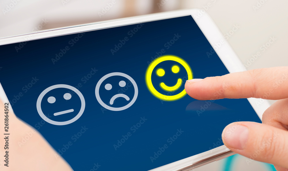 customer marking smiley face in customer satisfaction survey Stock ...