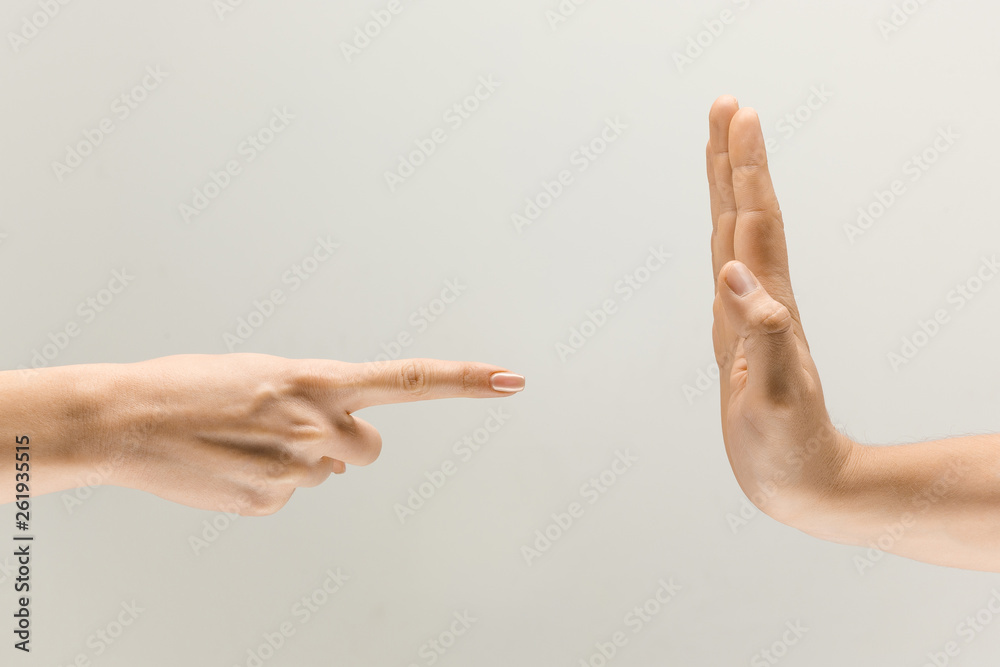 Woman rights. Two human hands showing sign of stopping isolated on grey ...