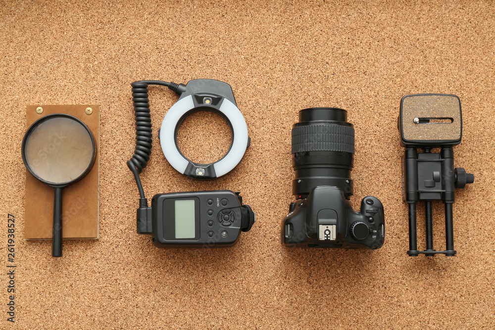 Modern equipment of professional photographer on cork background Stock ...