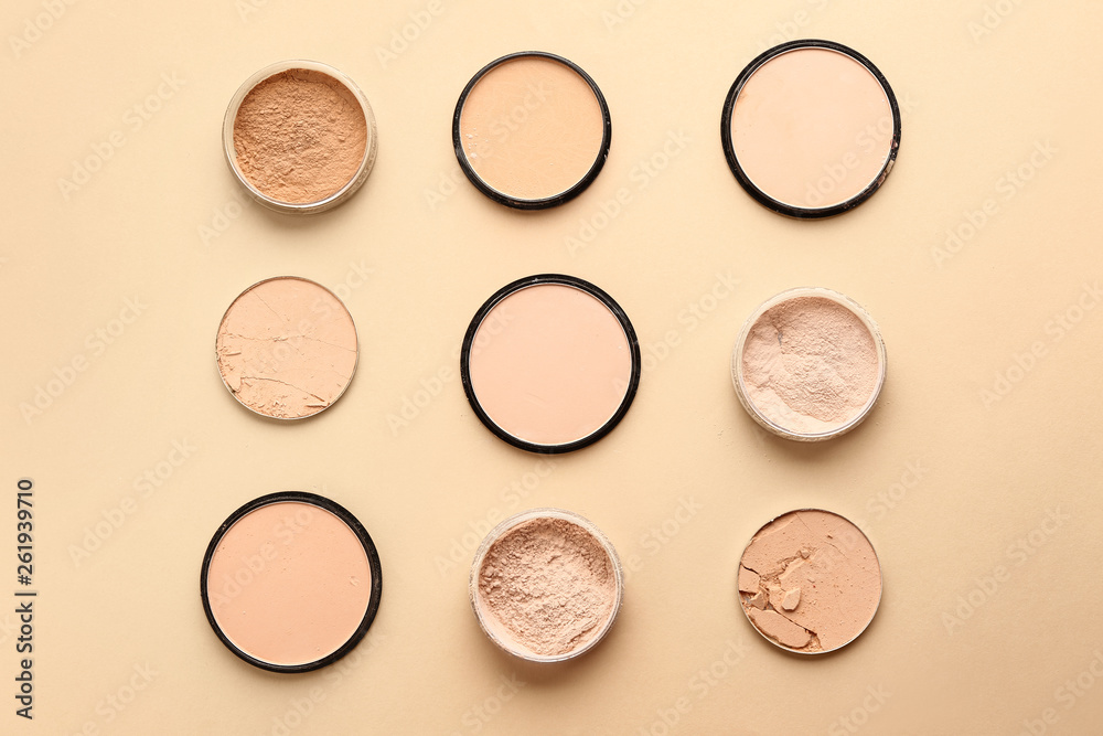 Different facial powder on color background Stock Photo | Adobe Stock