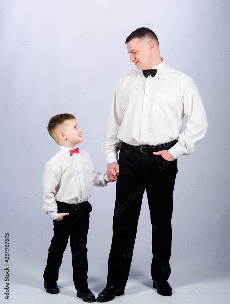 Little son following fathers example of noble man. Gentleman upbringing ...