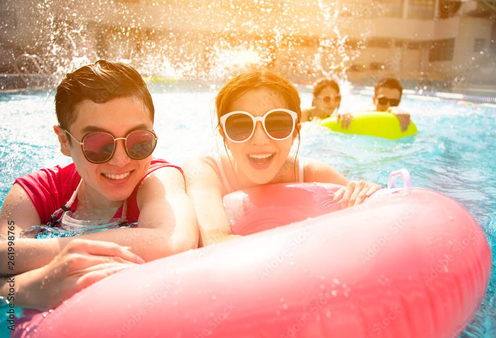 Happy friends playing in swimming pool on summer vacation Stock Photo ...