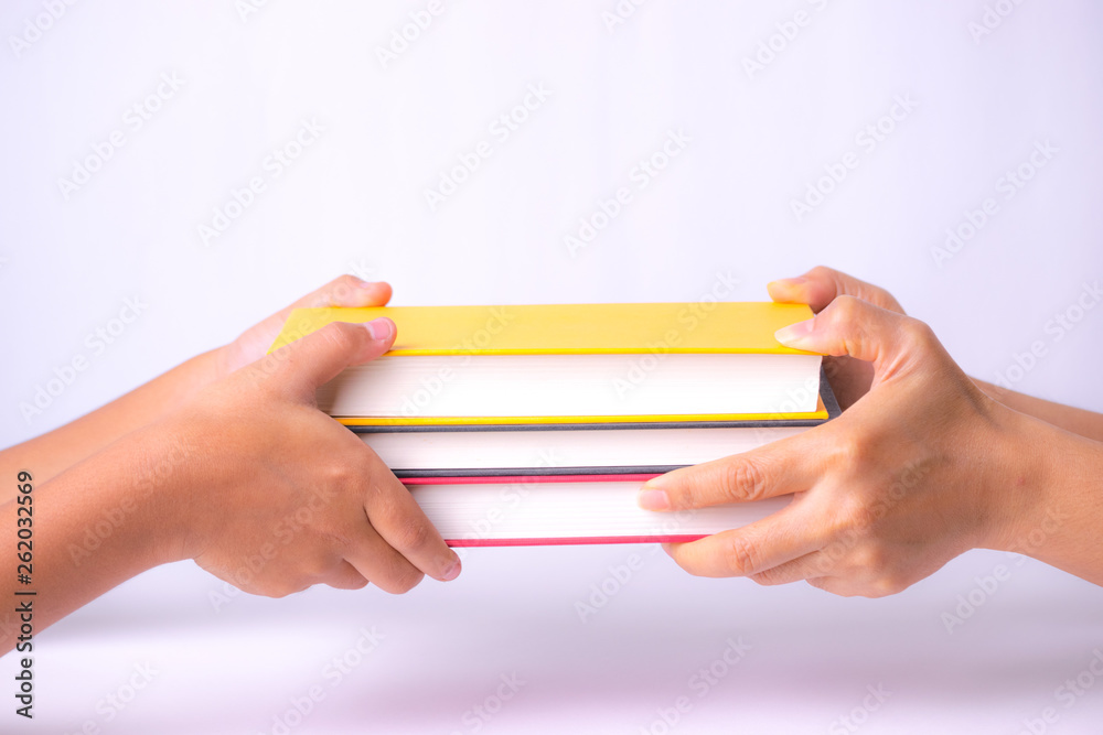 Education concept, World book day. Books in hands on white paper ...