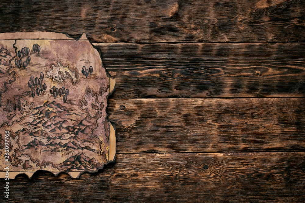 Old map on a adventurer table background with copy space. Treasure hunt ...
