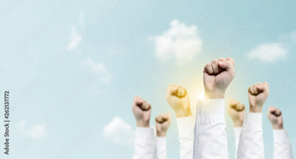 Group of hand businessmen raised the sky with sunlight. Victory as a ...