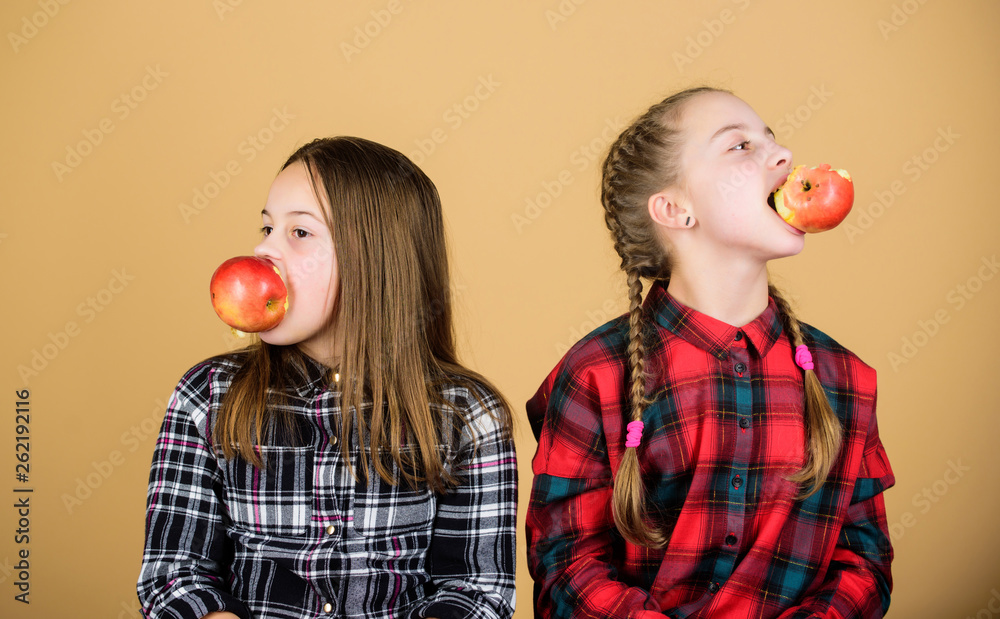 Fruit, fruit and more fruit. Little girls eating fresh fruits. Small ...