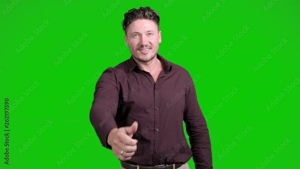 Bearded man shaking hand posture with green screen background. Smile ...