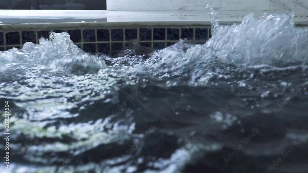 Splashing water in jacuzzi pool on spa center. Boiling water in jacuzzi ...