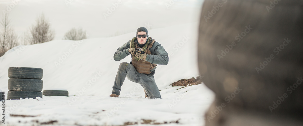 Crouching position military special forces soldier have combat shooting ...