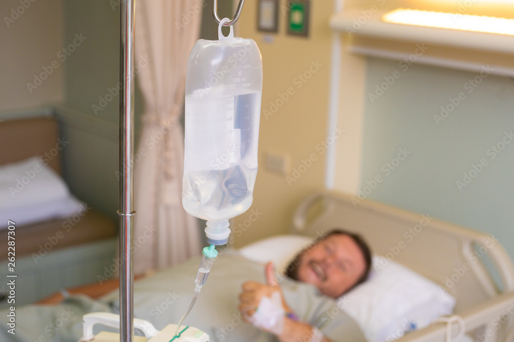 Close-up. Male hand with a dropper during chemotherapy in a hospital ...
