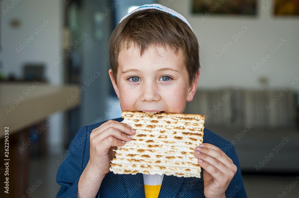 Foto de Cute Caucasian Jewish boy holding in his hands and taking a ...