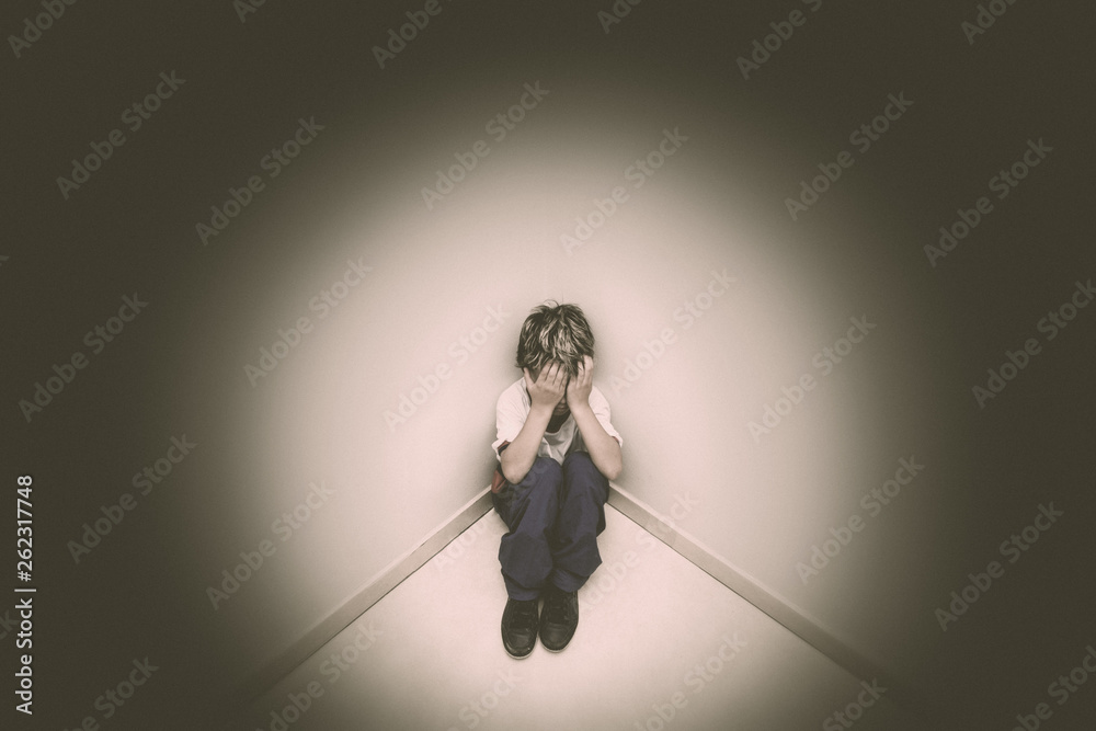 child in school uniform crying and hiding his face. Stock Photo | Adobe ...