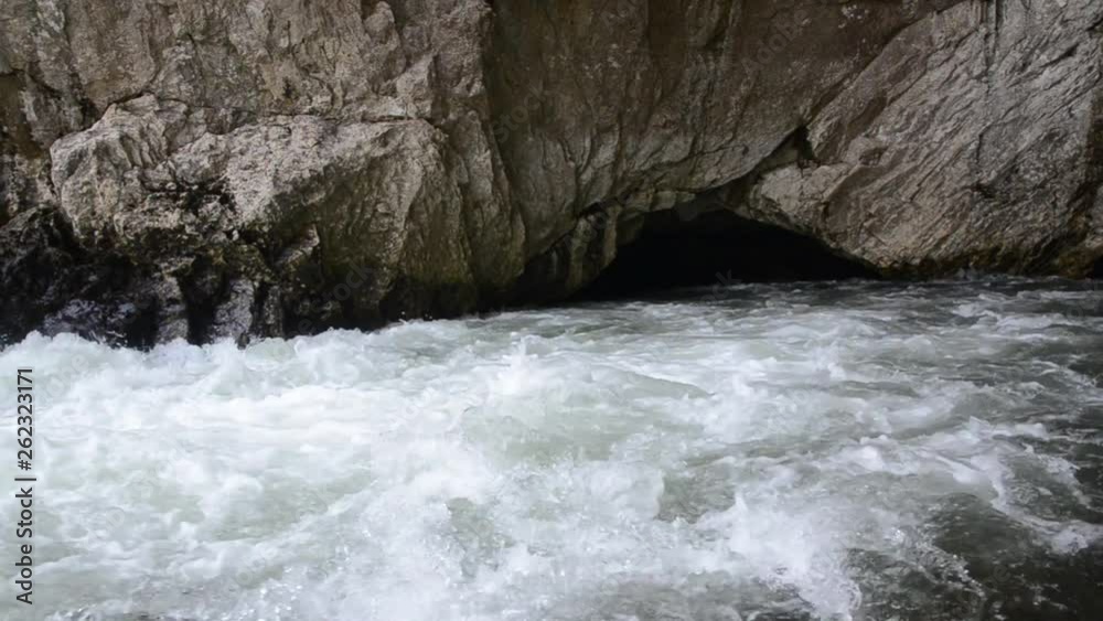 Video Stock River disappears into a cave. Subterranean river. River ...