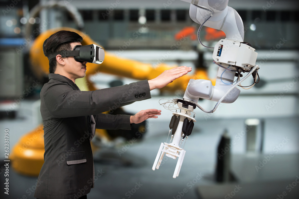 Virtual reality technology in industry 4.0. Business man suit wearing ...