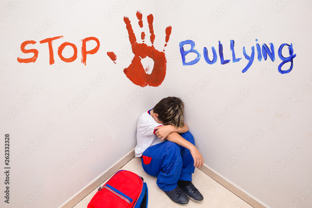 CHILD SUFFERING BULLYING, text over picture saying STOP BULLYING ...
