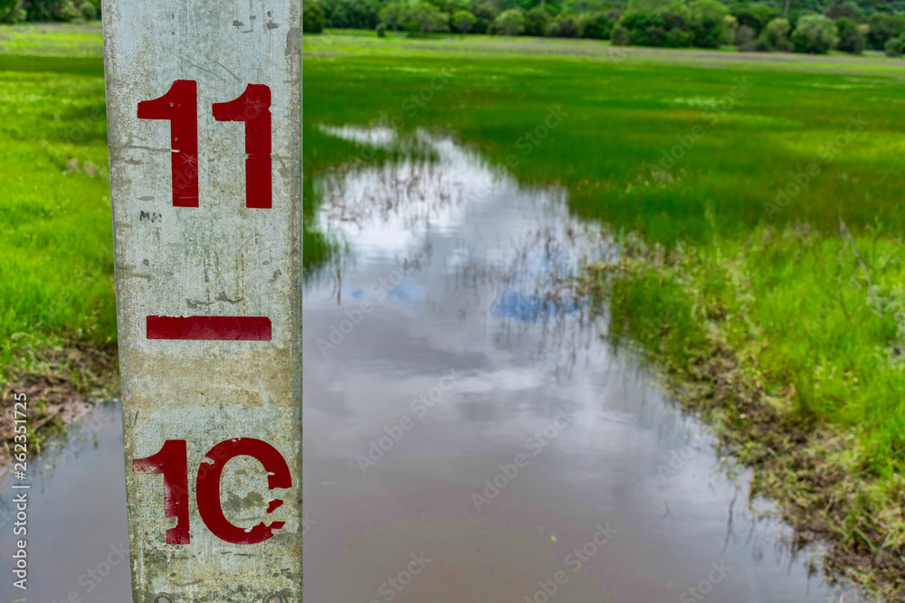Water level gauge indicator monitor the flood water in dam, lake on ...