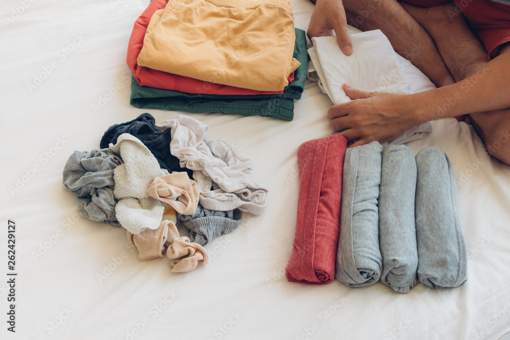 Man Folding Clothes