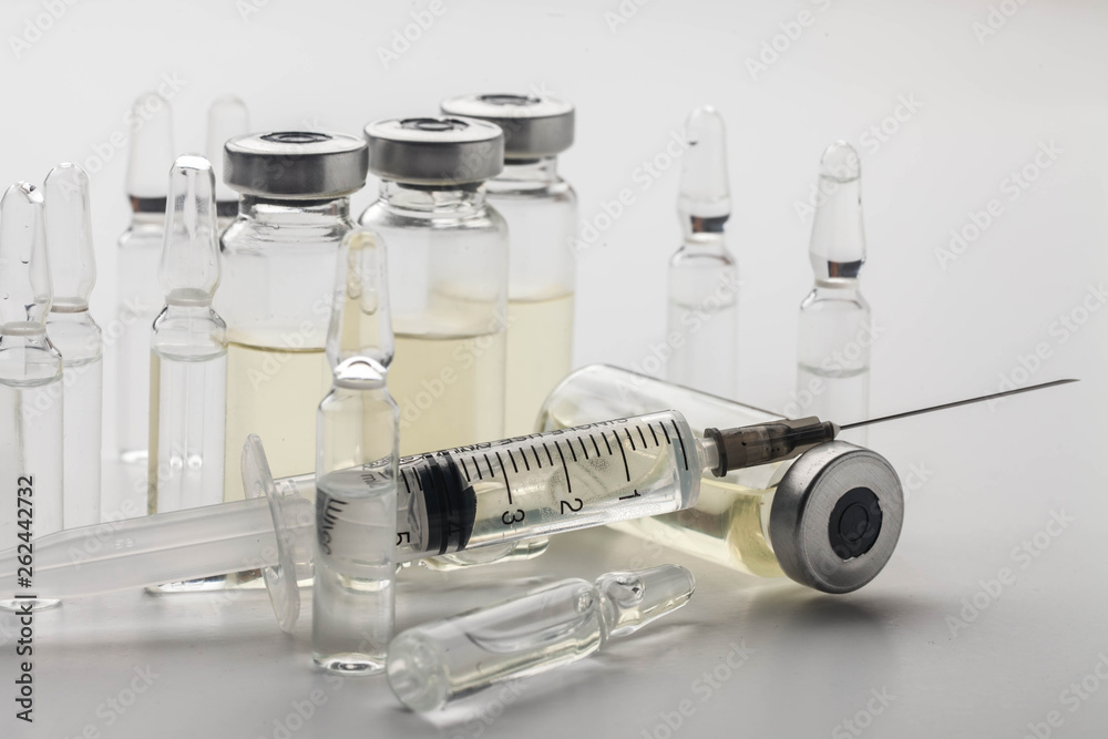 Subcutaneous syringe. Syringes with blue needles. Medical Injectors ...