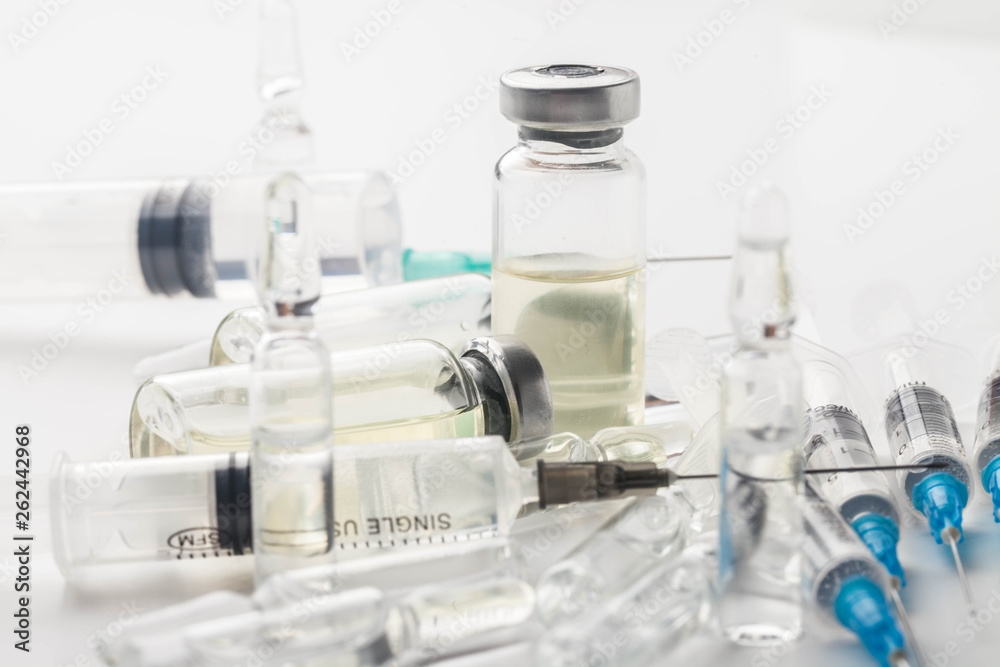 Subcutaneous syringe. Syringes with blue needles. Medical Injectors ...