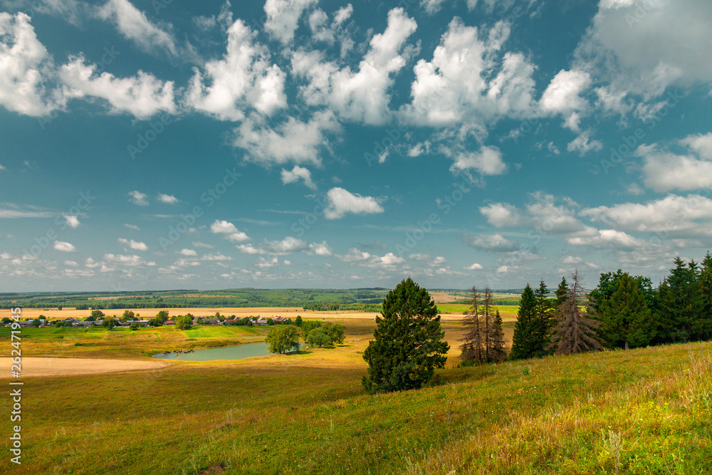 Panoramic high angle view of the plain, the village and the lake from ...