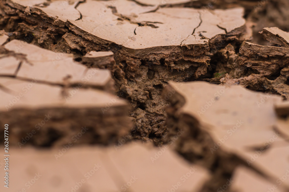 Deep cracks earth in the red land as a symbol of hot climate and ...