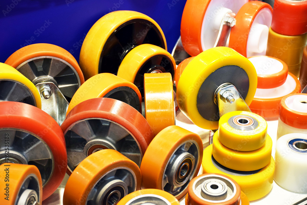 Group of different size and diameter industrial small wheels in warm ...