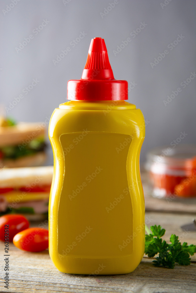 Yellow mustard squeeze bottle container with no label. Breakfast ...
