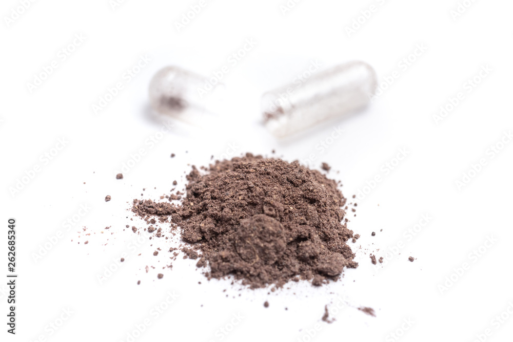 Herbal medicine in capsule isolate on white background. Herb black ...