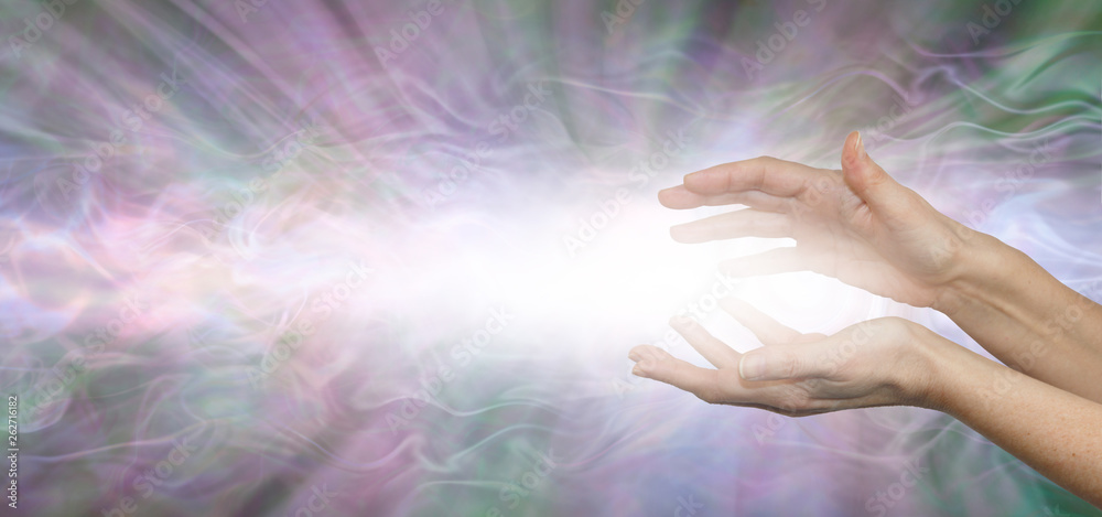 Energy flows where your attention goes - parallel female hands with an ...