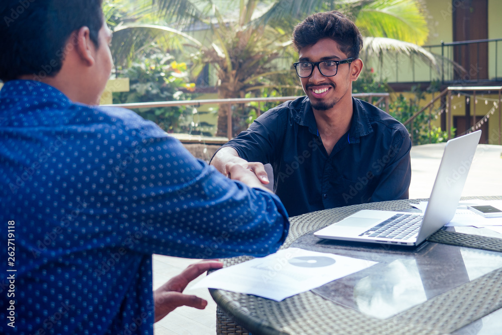 indian businessman coach leader with multiracial business partner ...