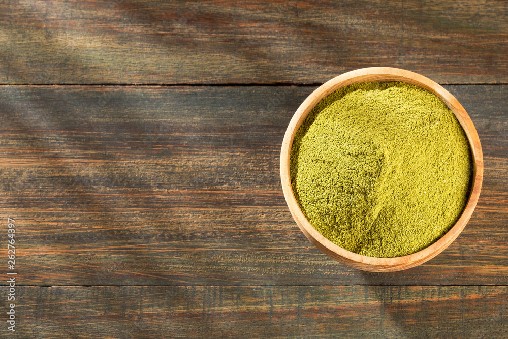 Moringa powder - Moringa oleifera. Wood background Stock Photo | Adobe ...