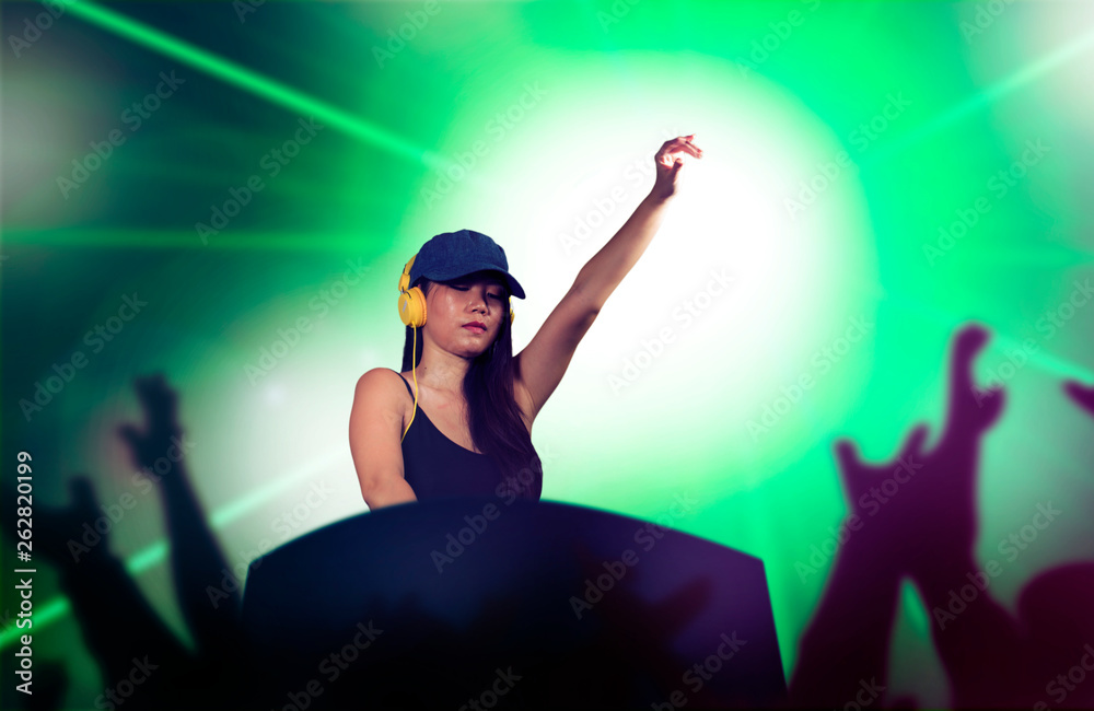 young attractive and happy Asian Chinese DJ woman remixing using deejay ...