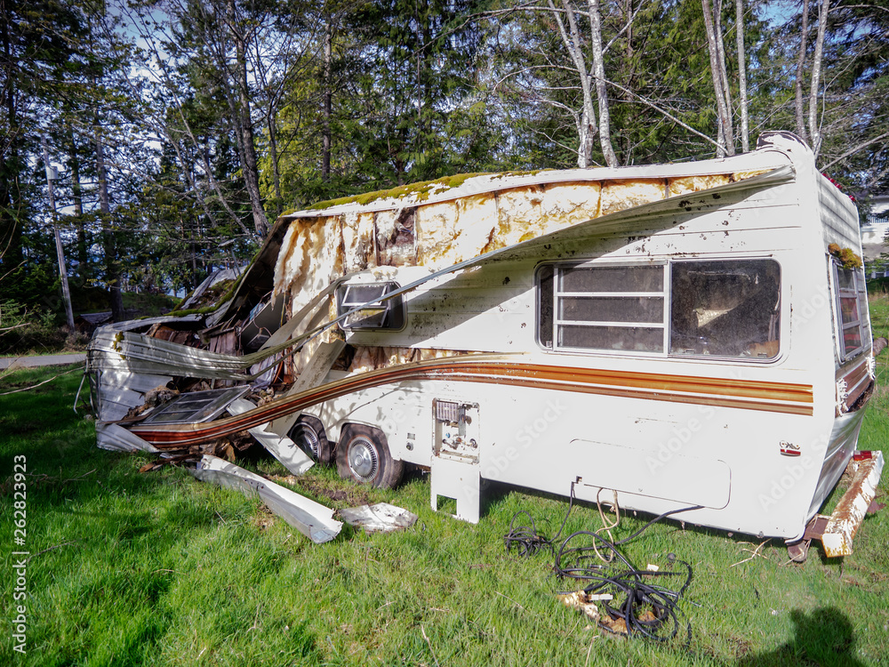 Trashed Trailer. An abandoned trashed trailer on a rural lot. Stock ...