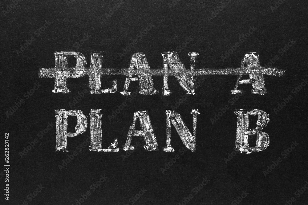 Planning concept. Handwritten white chalk plan A and B on blackboard ...