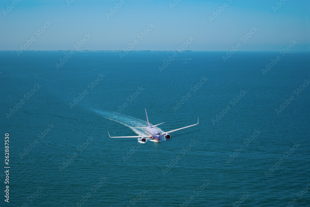 A large passenger jet plane airliner making an emergency crash landing ...