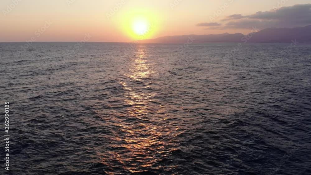 Video „Ripply sea waves slowly move, sun shine bright, hang low over ...