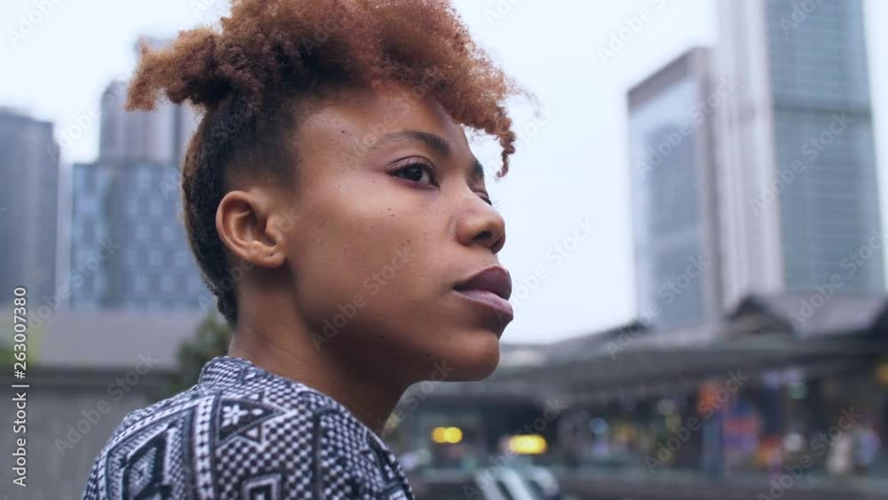 Slow motion Close up side view of young black African young woman ...