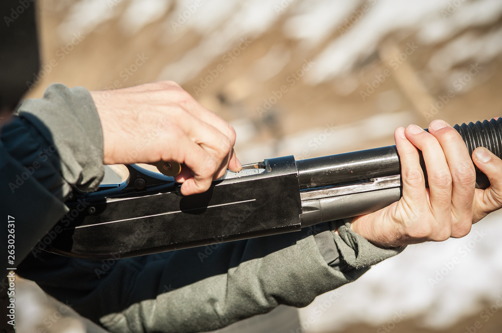 Soldier hands load shotgun bullets patrons into cartridge clip Stock ...