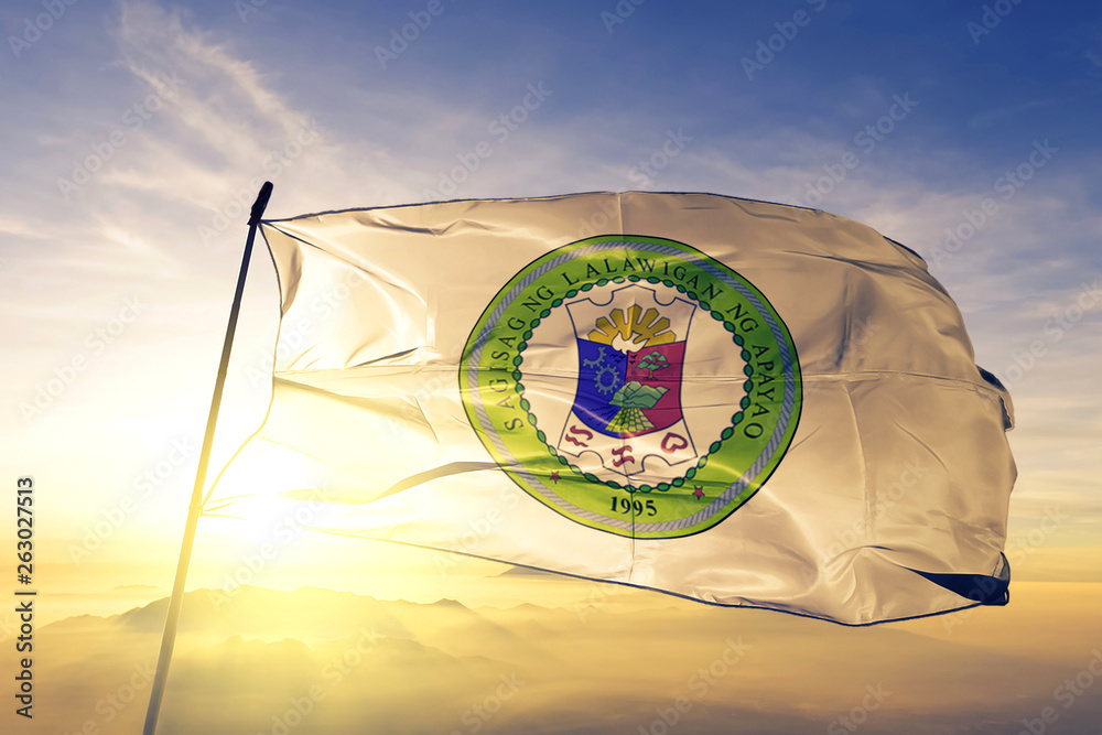 Apayao province of Philippines flag waving on the top sunrise mist fog ...