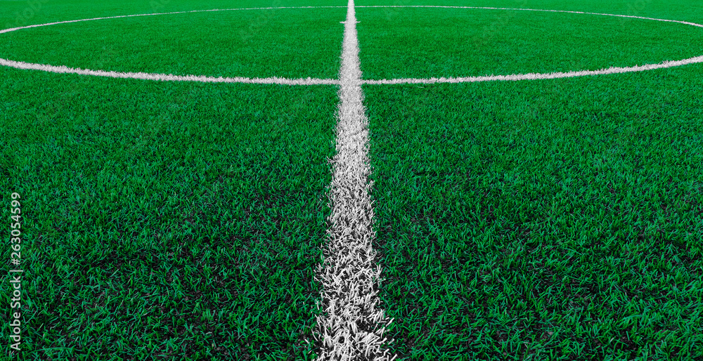 Artificial turf soccer field with center marker line. Stock Photo ...