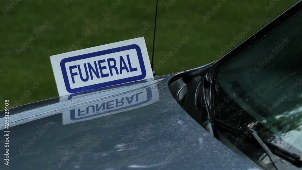 Funeral card inserted into car hood. Raindrops on car hood. Stock Video ...