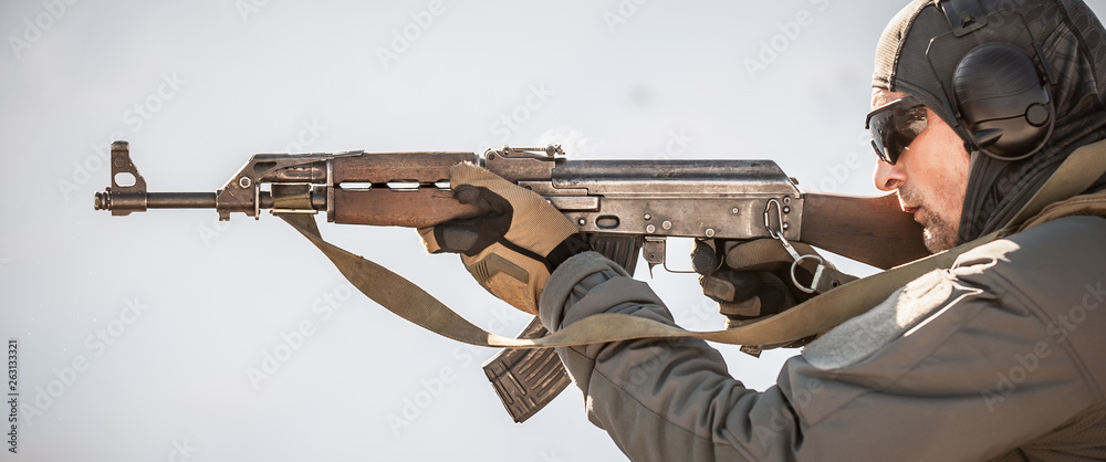 Military soldier in action combat shooting from rifle machine gun Stock ...