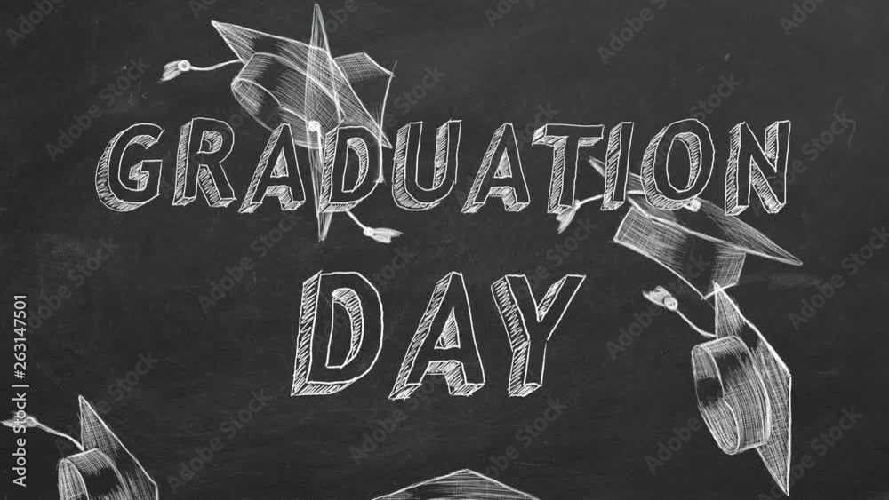 Hand drawing text "Graduation day" and graduation caps on blackboard ...